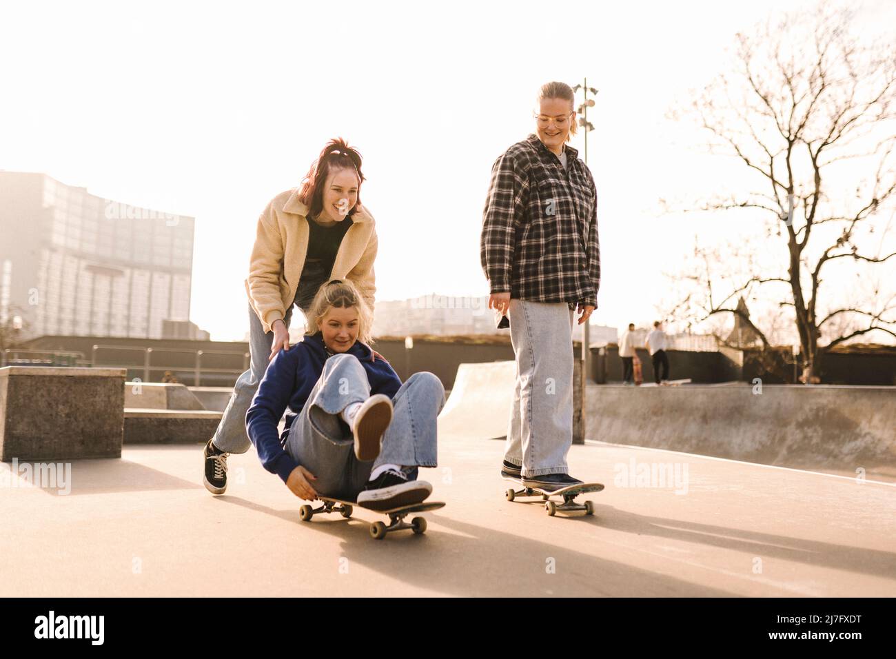 Teenage girls skateboarding in skatepark Stock Photo - Alamy