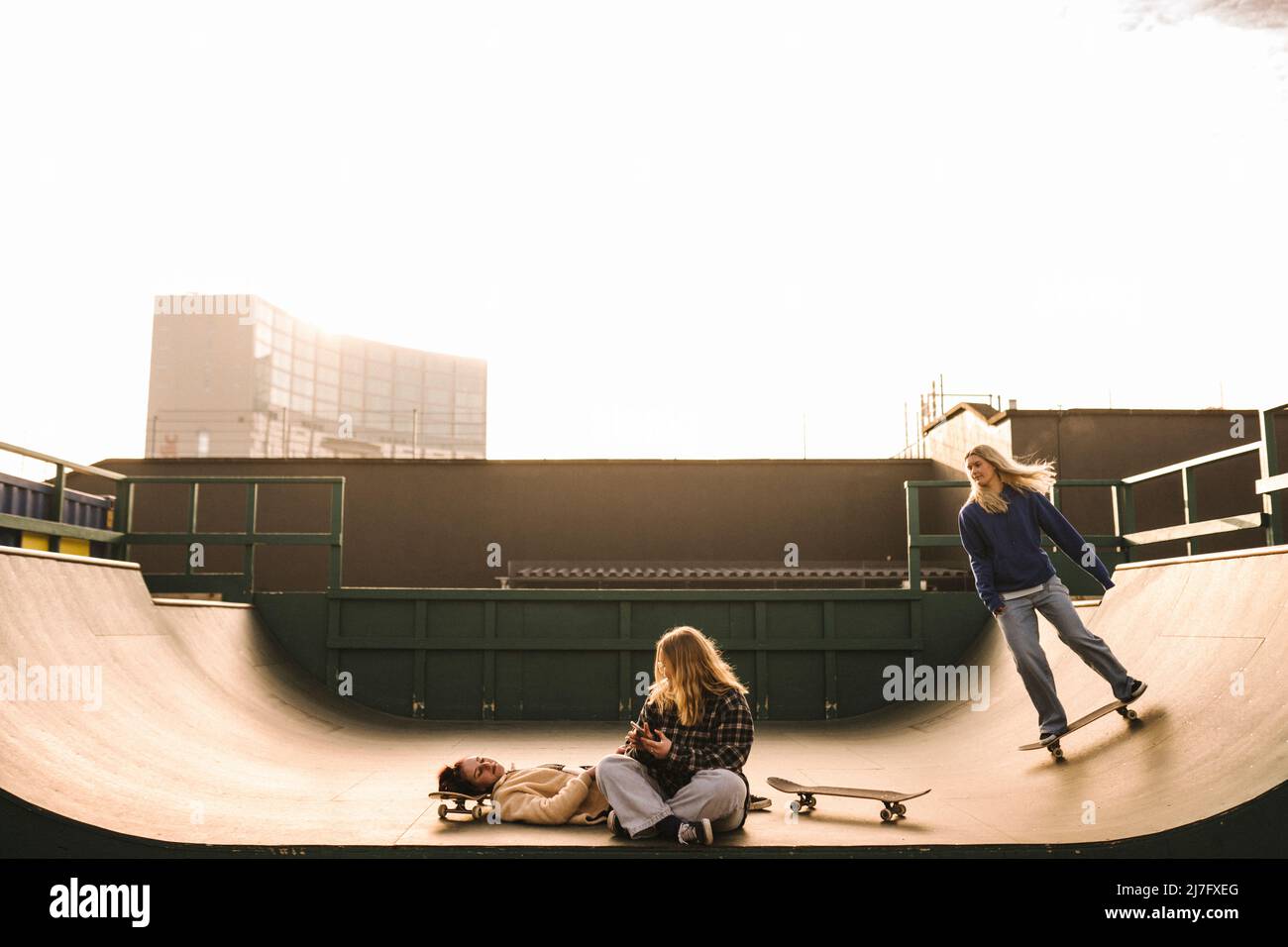 Teenage girls skateboarding in skatepark Stock Photo - Alamy