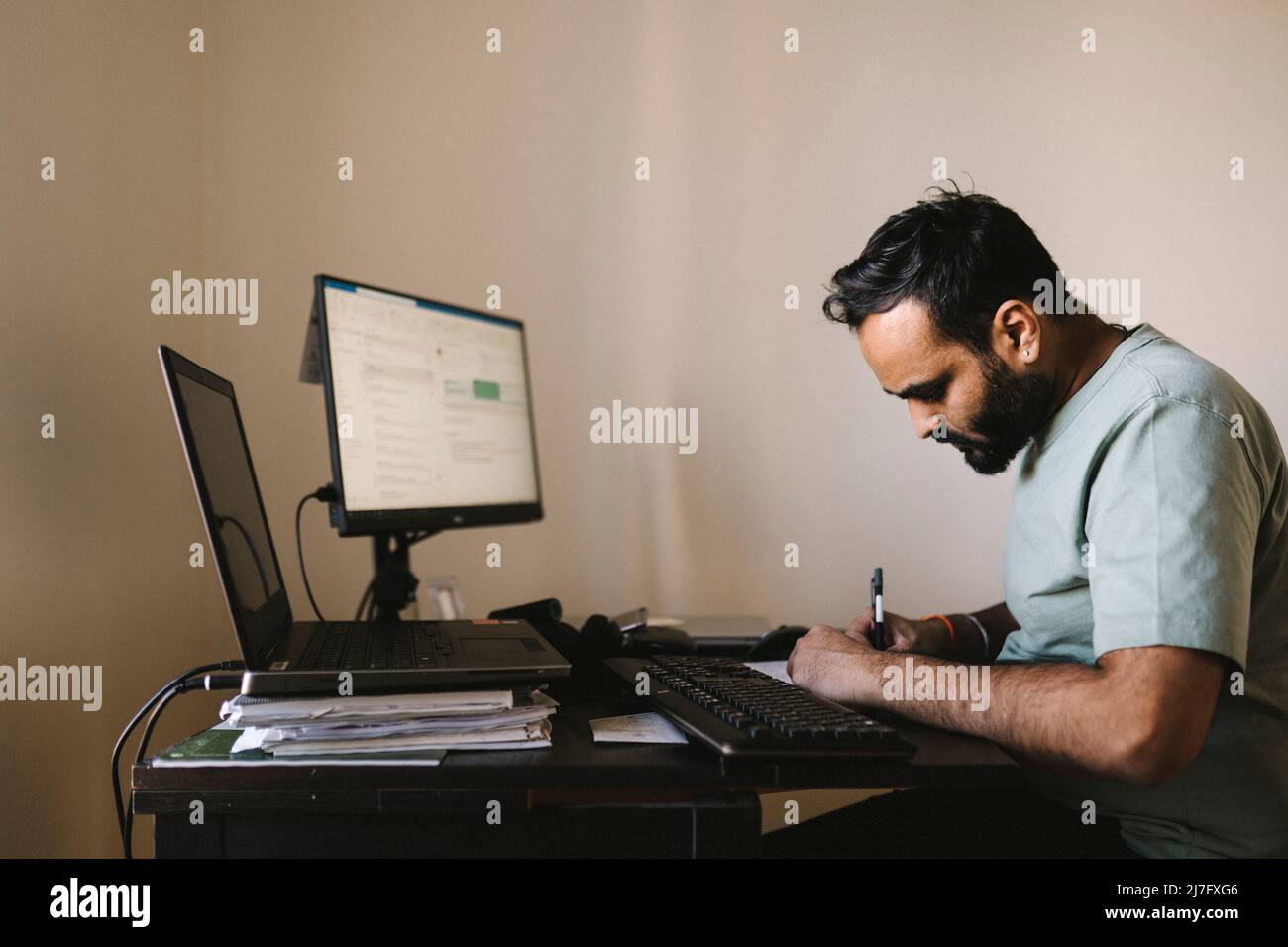 Man working from home Stock Photo - Alamy