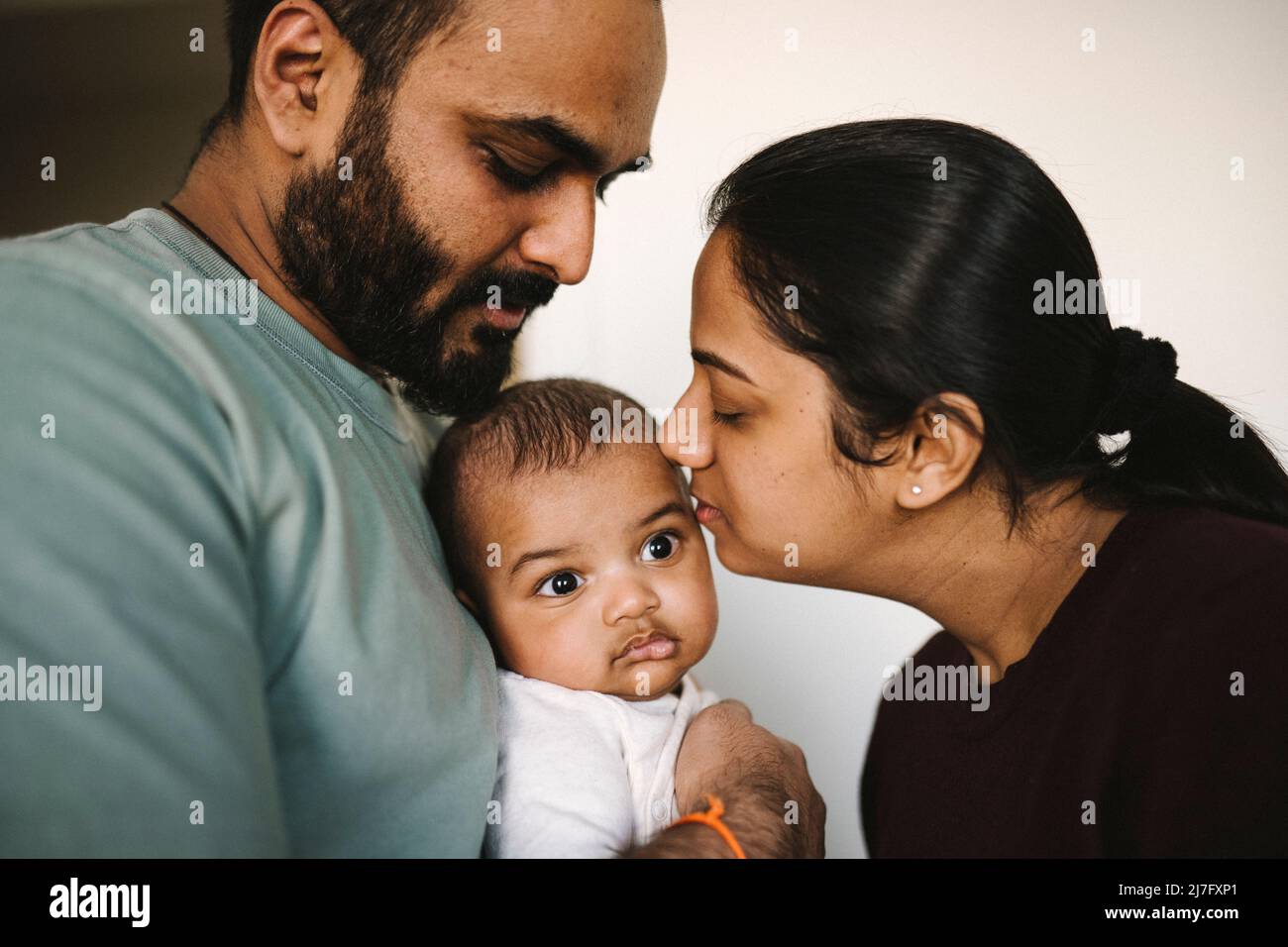 Father and mother with baby Stock Photo - Alamy