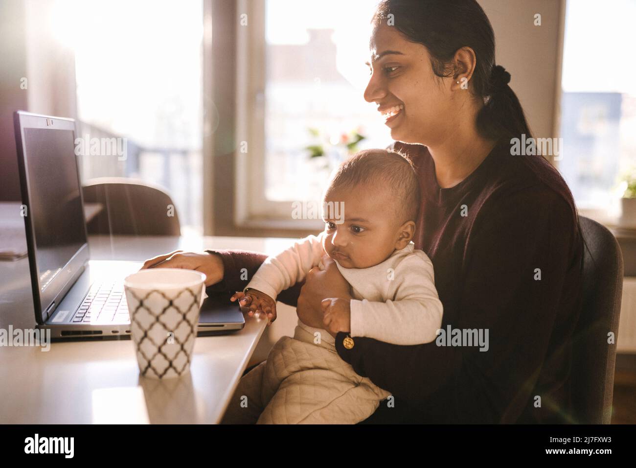 Baby working hi-res stock photography and images - Alamy