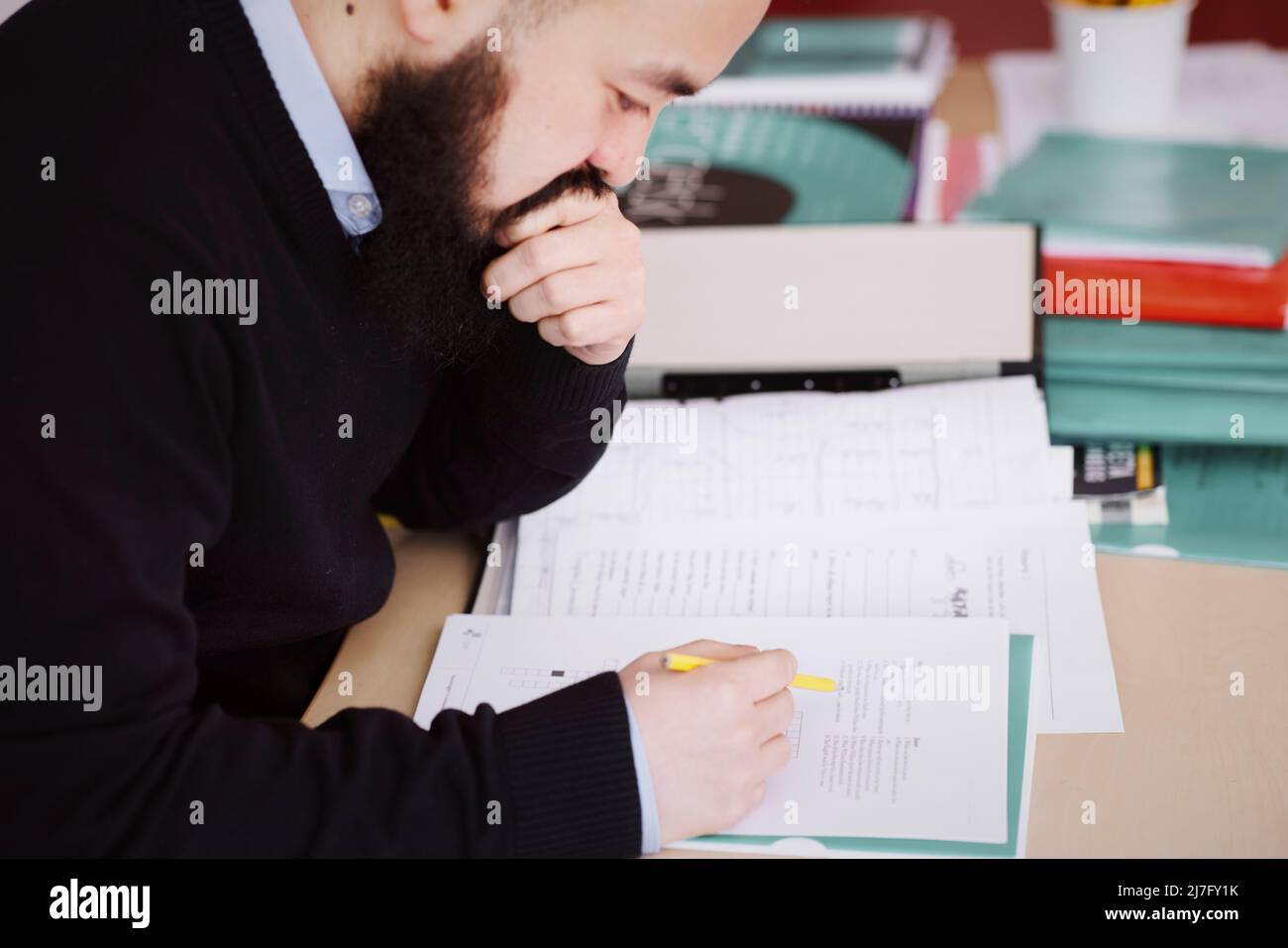 Teacher working in classroom Stock Photo - Alamy