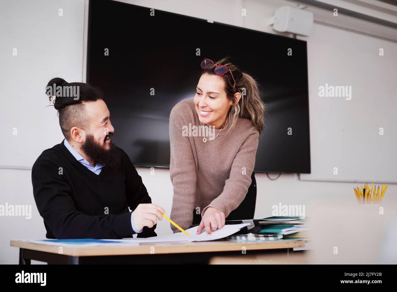 Two teachers talking in class hi-res stock photography and images - Alamy