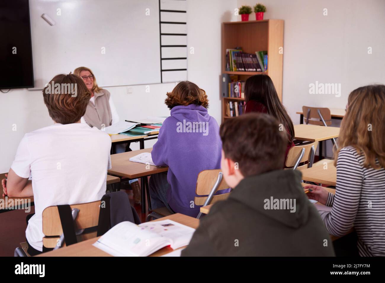 Teenagers in classroom Stock Photo - Alamy