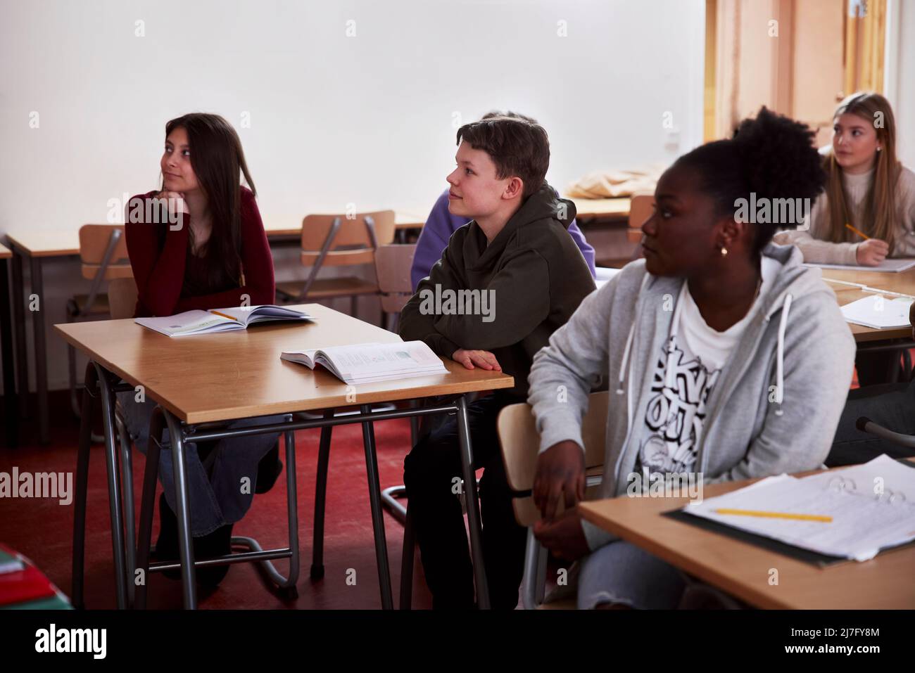 Teenagers in classroom Stock Photo - Alamy