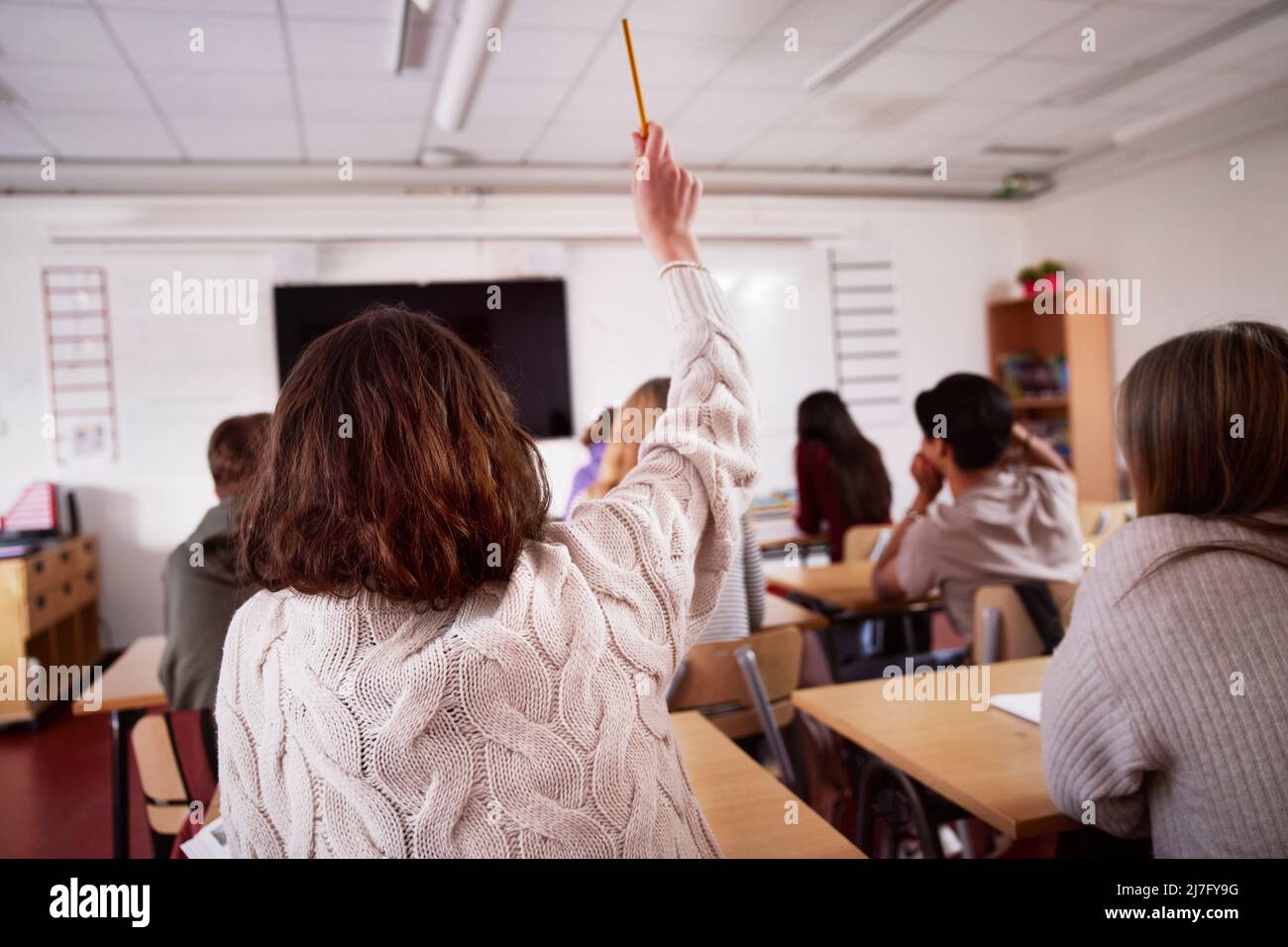 Teenagers in classroom Stock Photo - Alamy