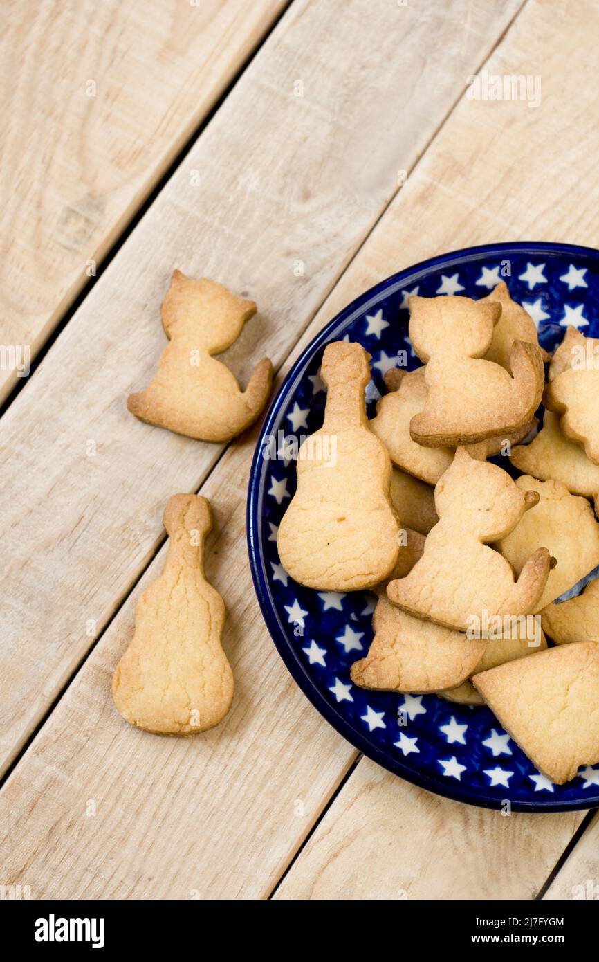 Blue plate in the stars, with tasty cookies in the form of figurines of ...