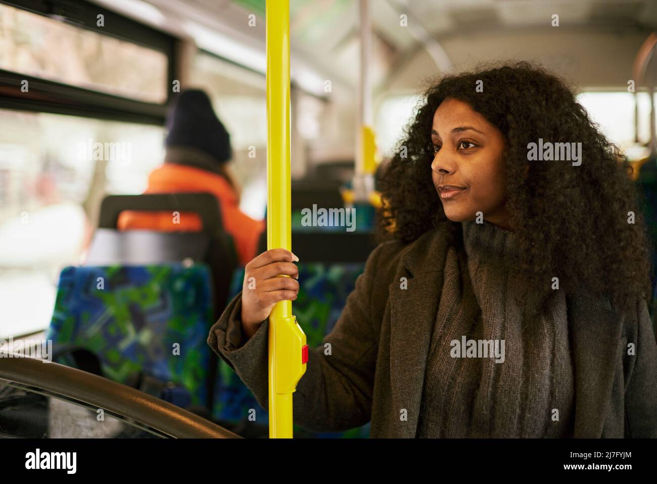 Woman in bus looking away Stock Photo - Alamy
