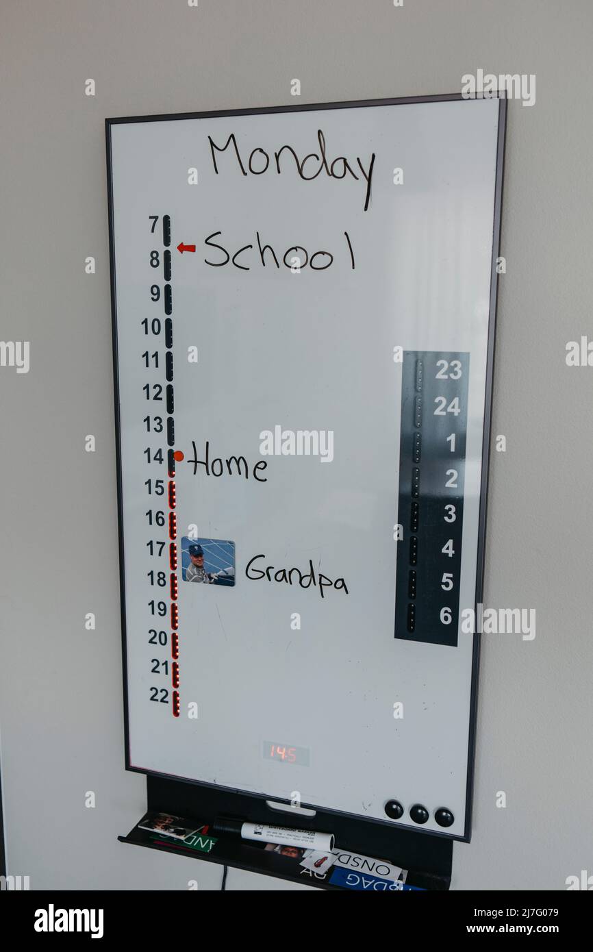 Notice board with schedule Stock Photo - Alamy
