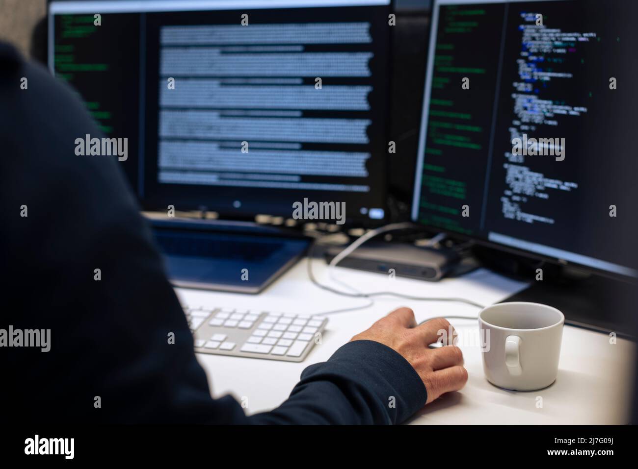 Male programmer working on computer Stock Photo - Alamy