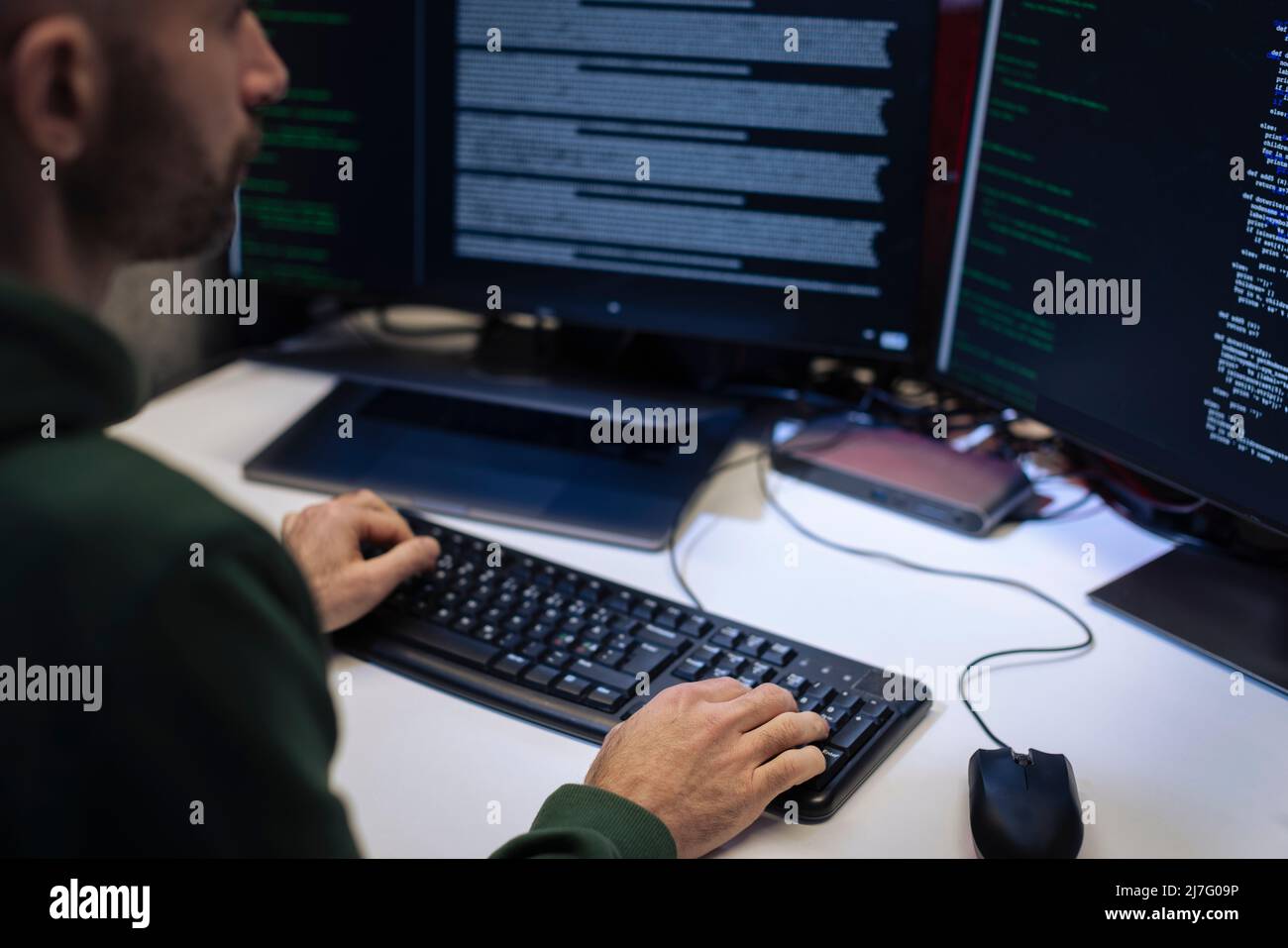 Male programmer working on computer Stock Photo - Alamy