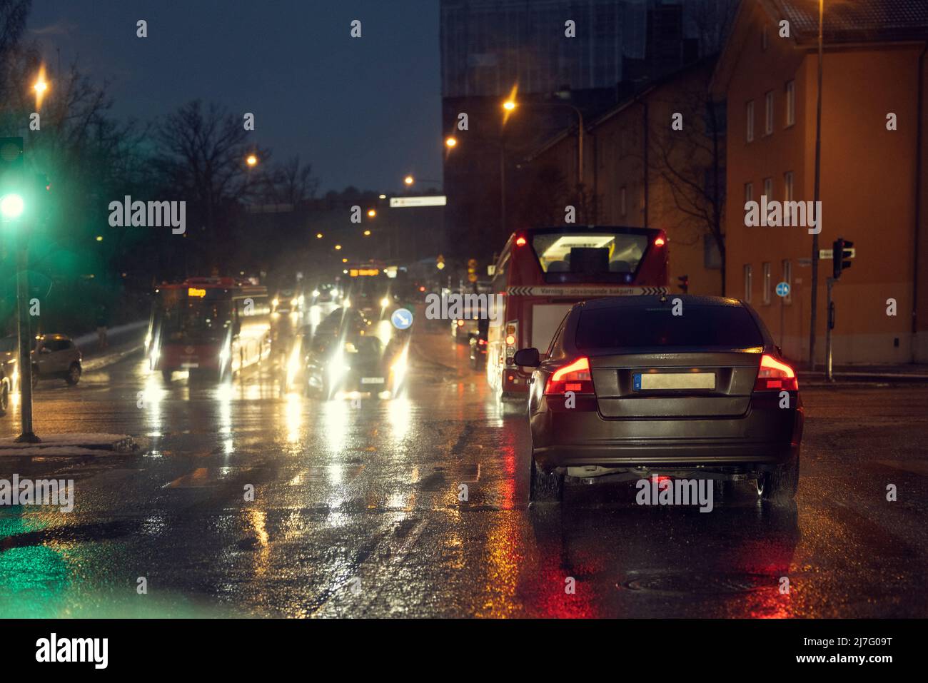 Traffic at intersection in city Stock Photo - Alamy