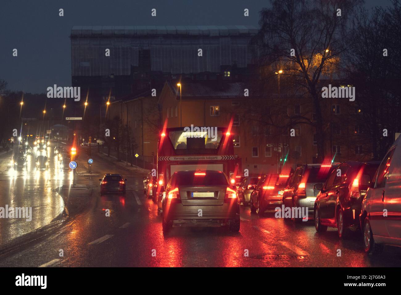 Cars waiting at red light at intersection Stock Photo - Alamy