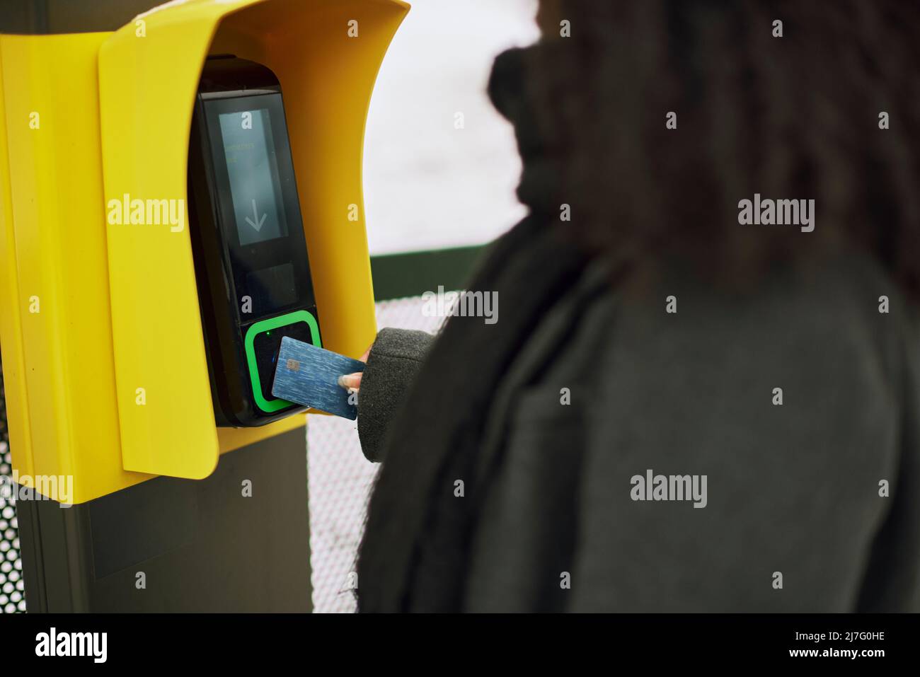 Woman paying for ticket with credit card Stock Photo - Alamy