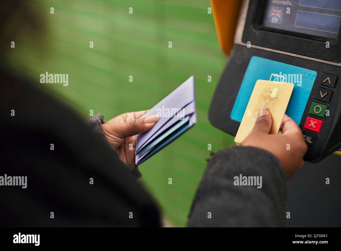 Woman paying for ticket with credit card Stock Photo - Alamy