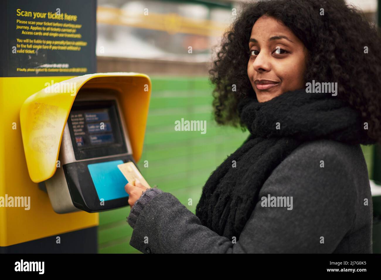 Woman paying for ticket with credit card Stock Photo - Alamy