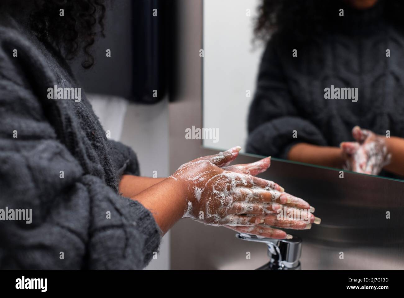 Mid section of woman washing hands Stock Photo - Alamy