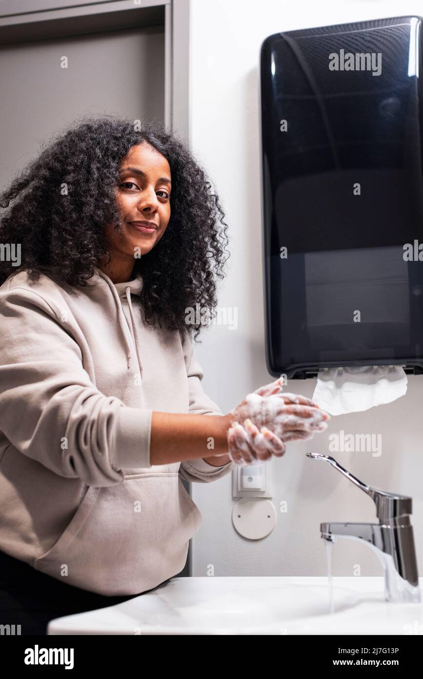 View of woman washing hands Stock Photo - Alamy