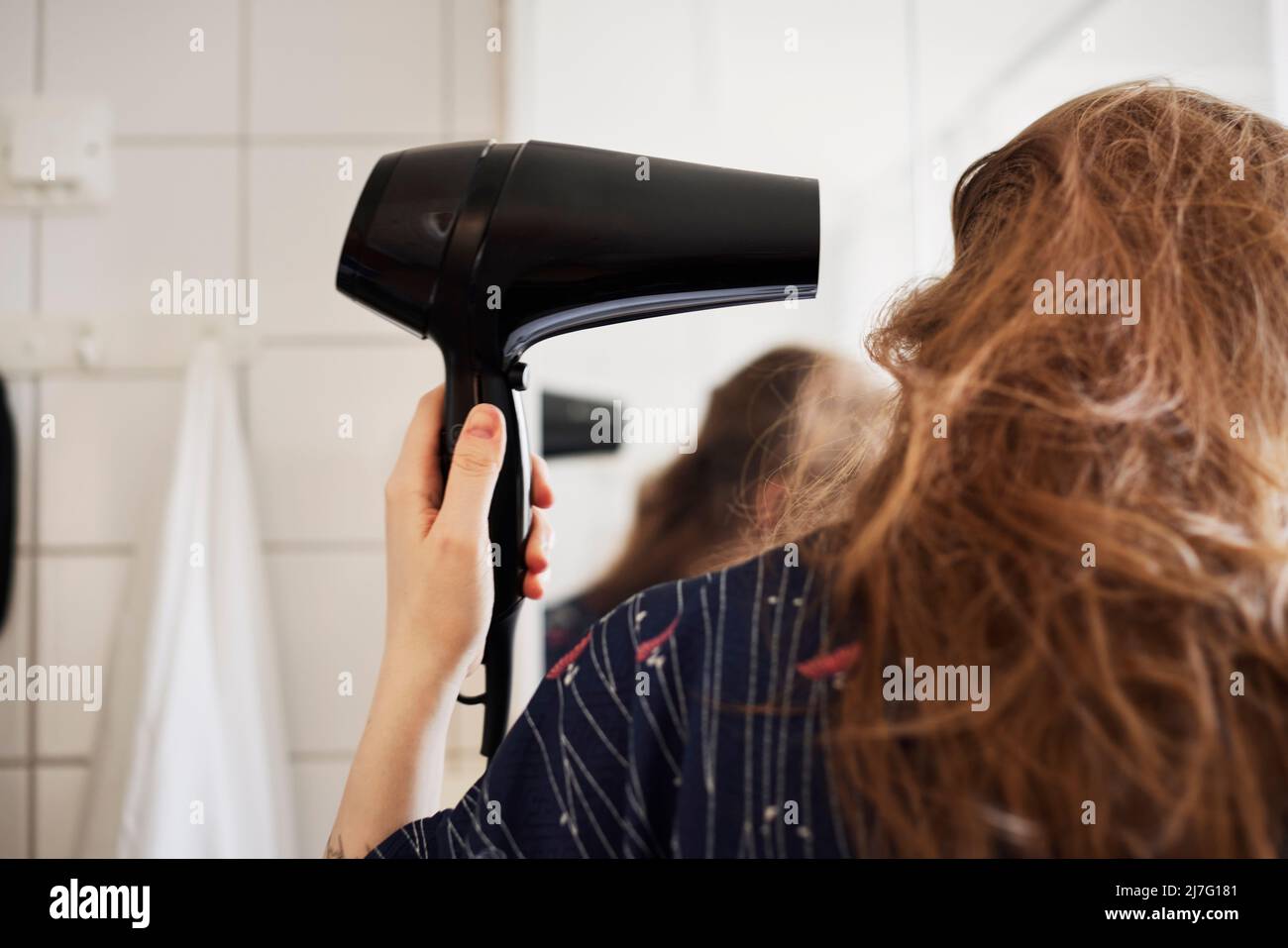 Woman drying hair Stock Photo - Alamy
