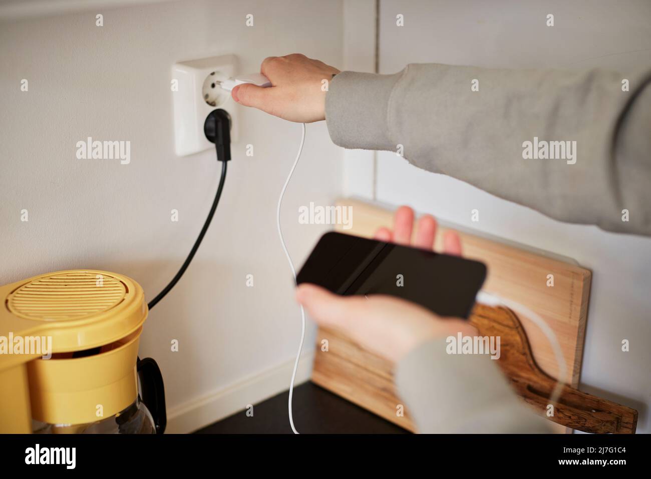 Hands plugging charger cell phone hi-res stock photography and images ...