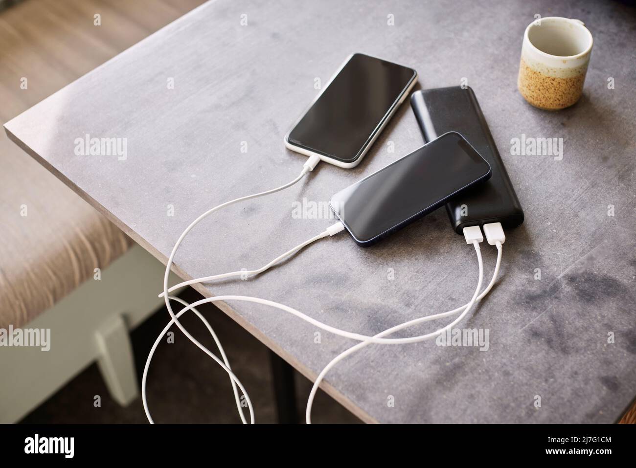 Cell phones connected to power bank Stock Photo - Alamy