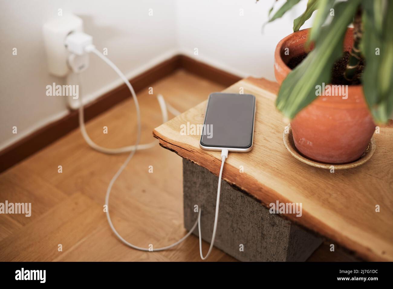 View of charging cell phone Stock Photo - Alamy