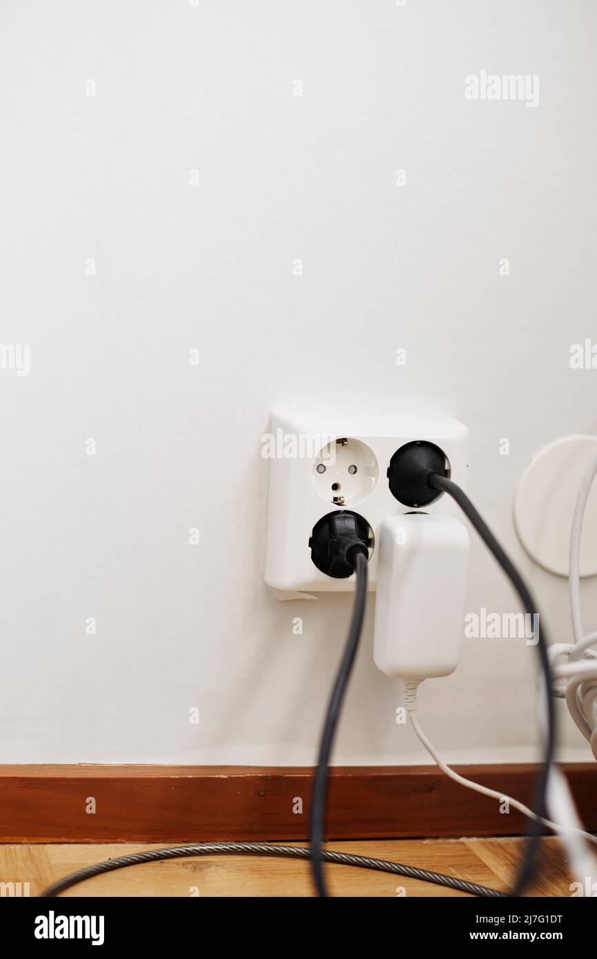 Wall socket with plugs Stock Photo - Alamy