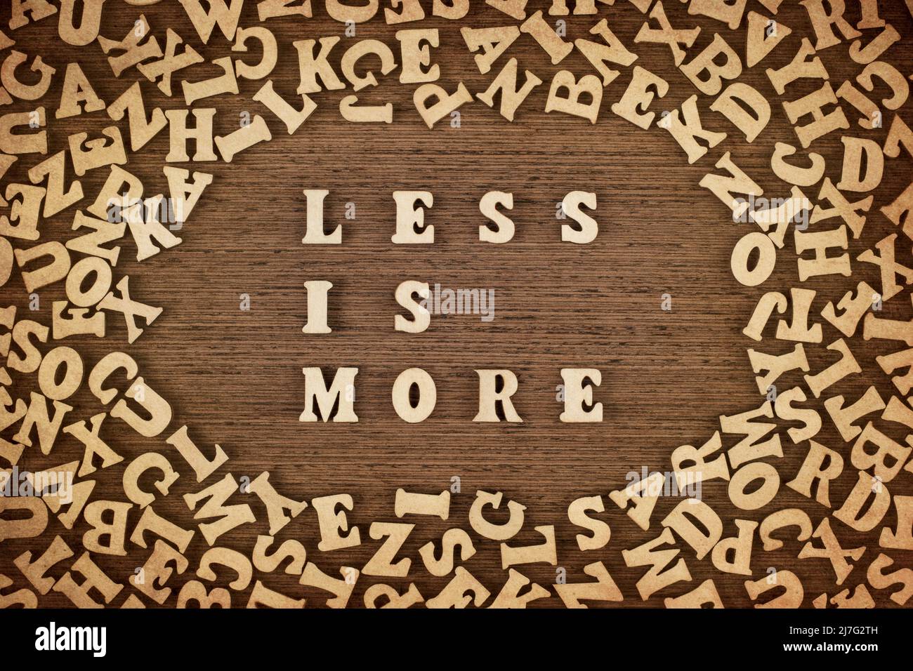 "Less is more" phrase made with wooden letters on table, concept Stock ...