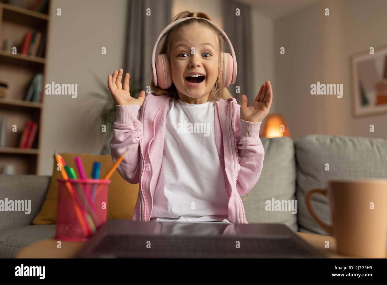 Excited Girl Video Calling Via Laptop Learning Online At Home Stock ...