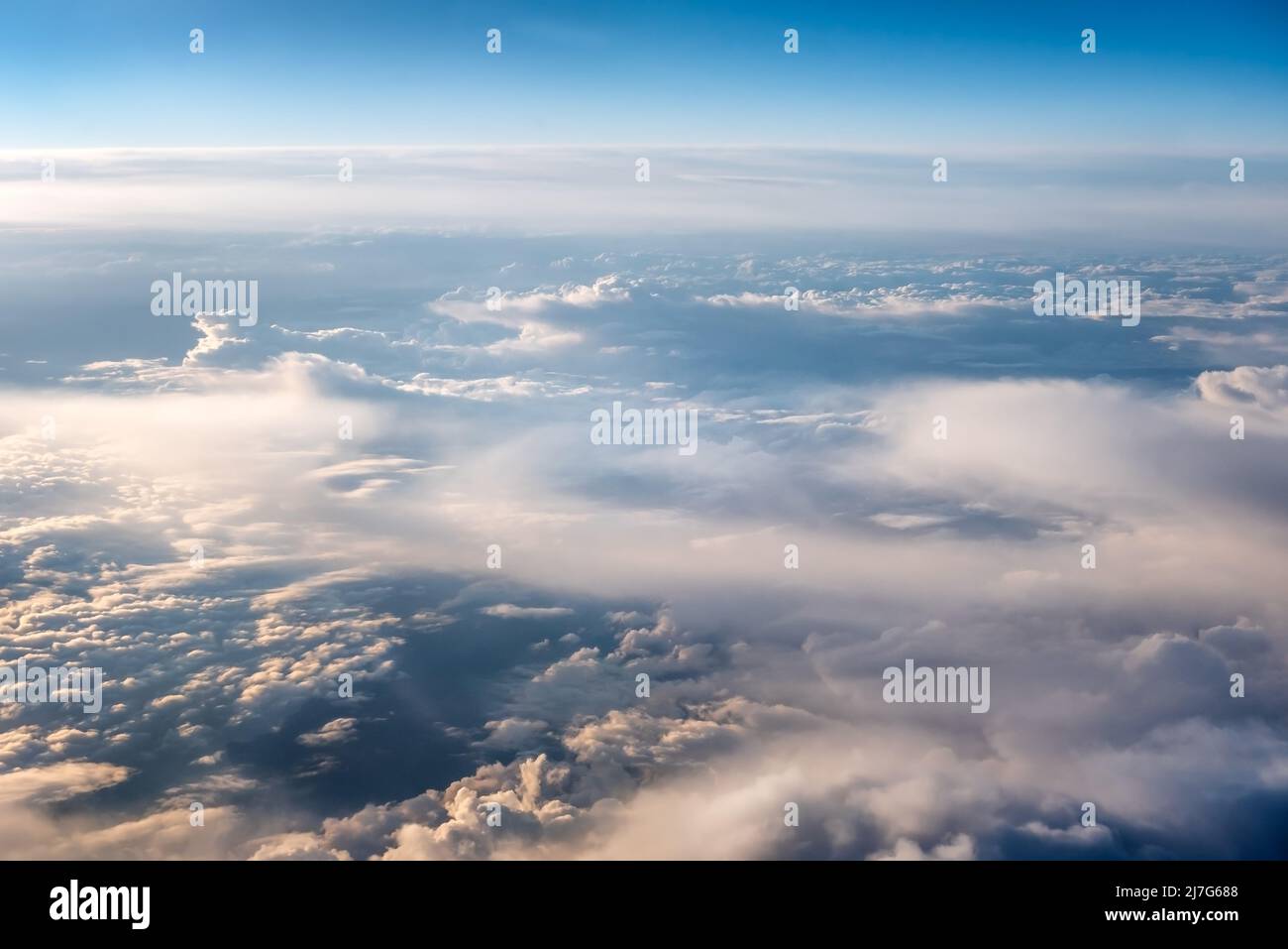White cumulus clouds on clear blue sky background closeup, overcast ...