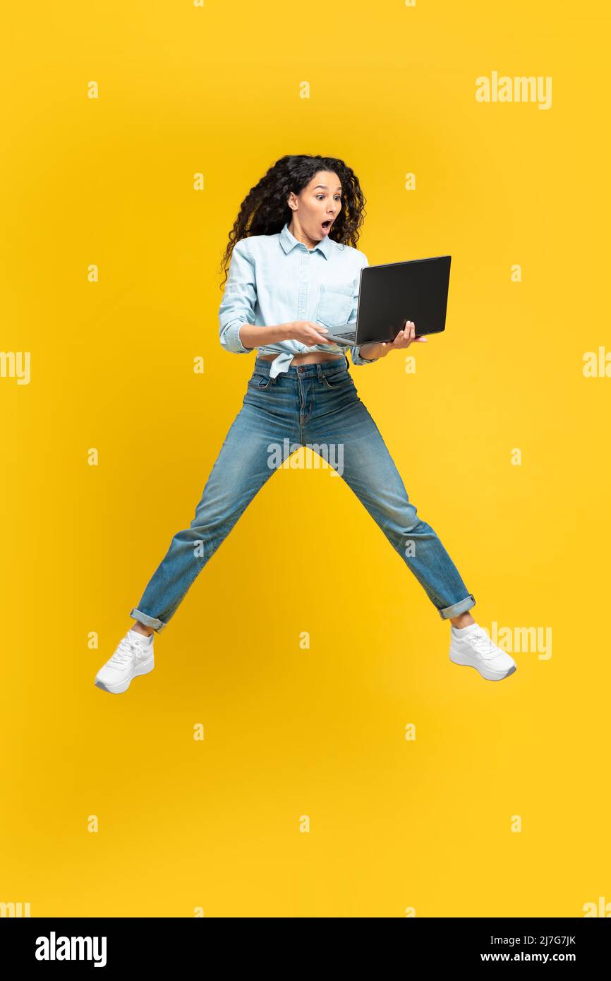 Amazed woman shocked laptop isolated hi-res stock photography and ...