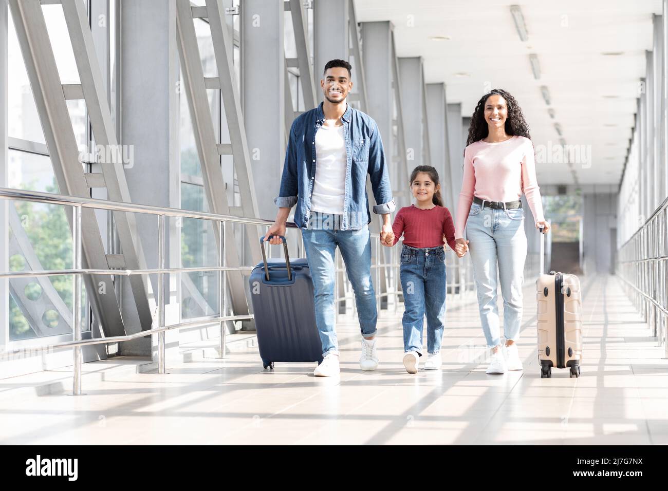 Vacation Trip. Happy Arab Family Walking With Luggage At Airport ...