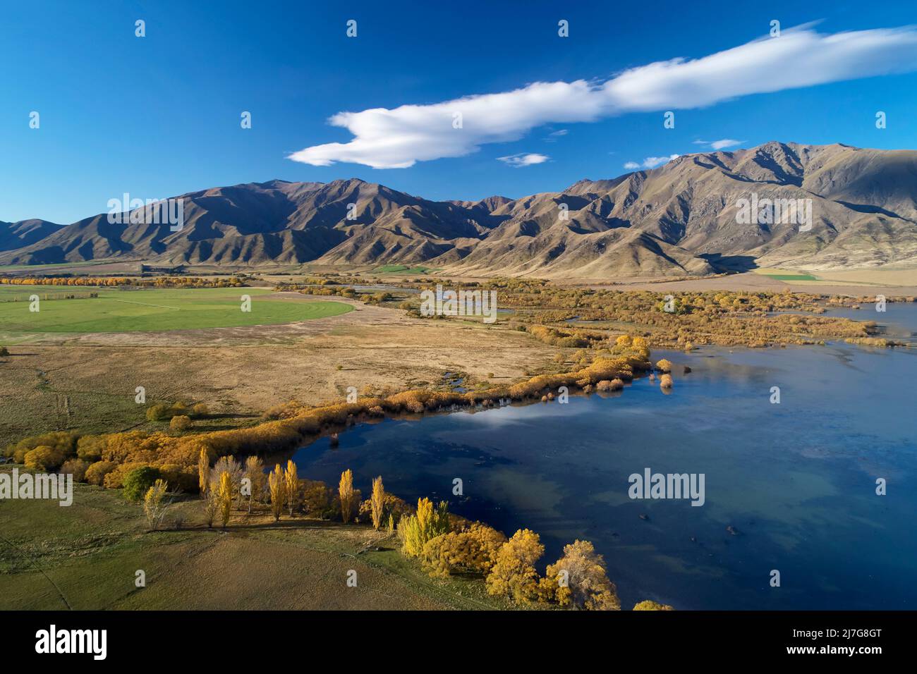 Autumn colours, Lake Benmore, Ahuriri River Delta, and Benmore Range ...