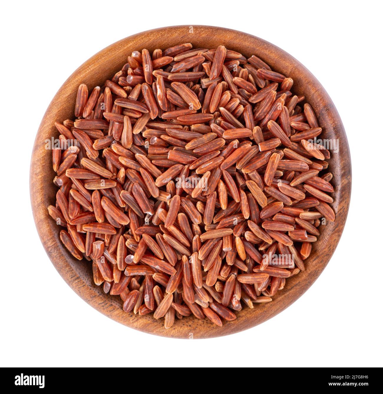 Red rice isolated in wooden bowl, on white background. Whole grain raw ...