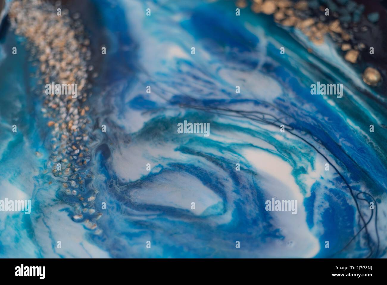 Epoxy resin art. Texture of blue and white paint. Fluid art, kintsugi ...