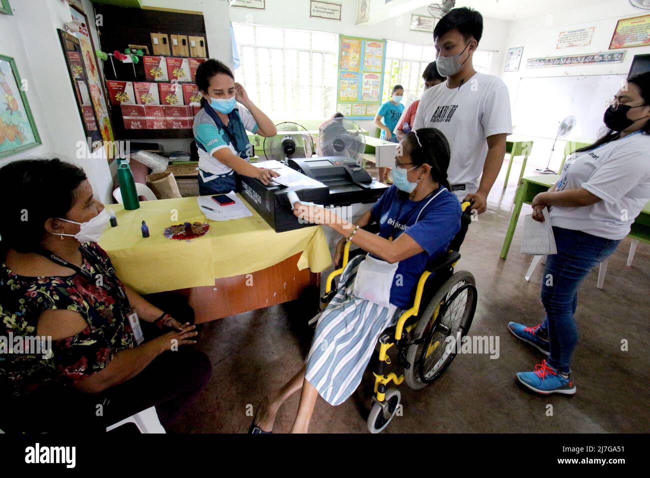 Philippines. 09th May, 2022. Person With Disabilities (PWD) while she ...
