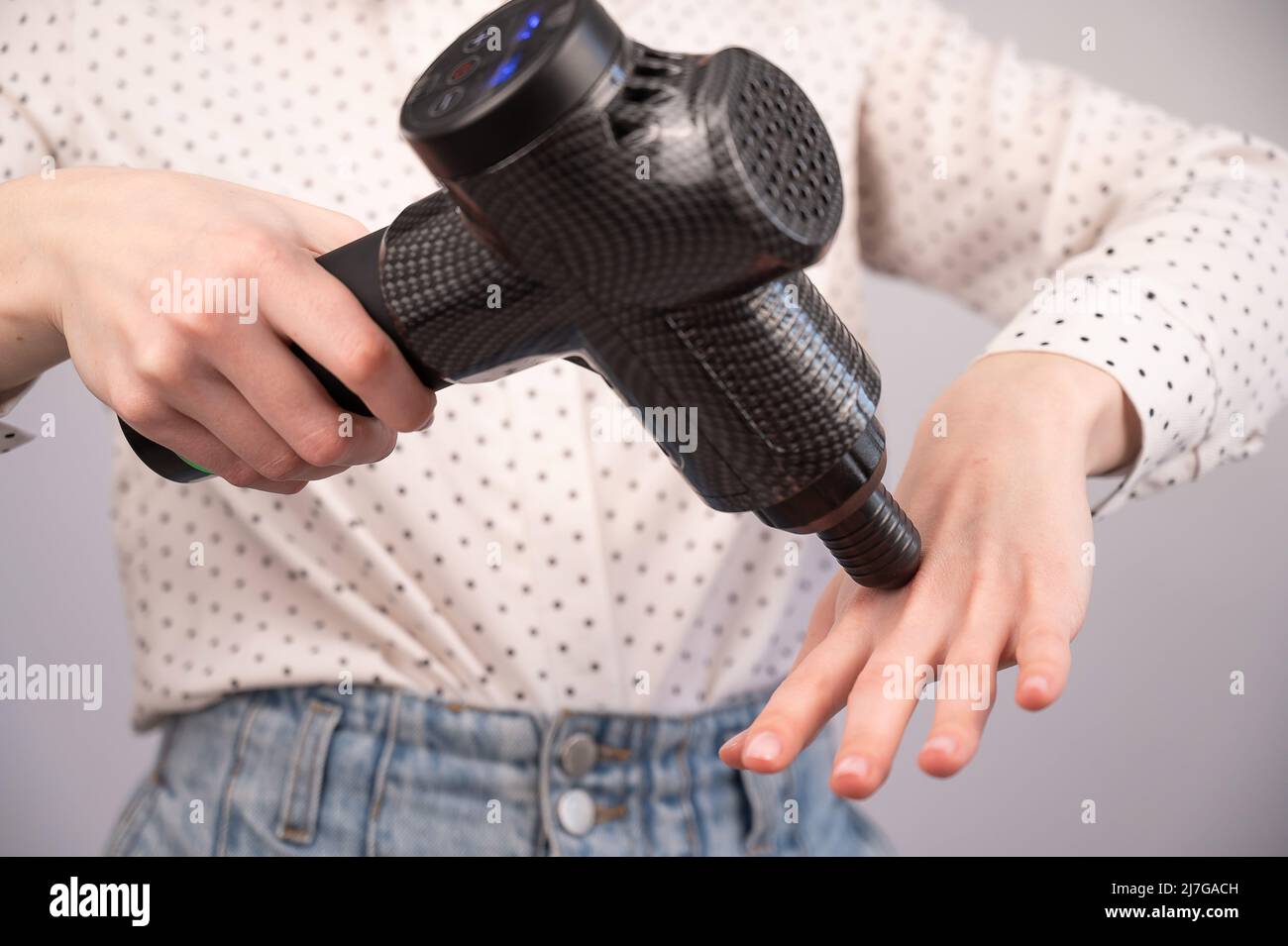 Woman using massager electric hi-res stock photography and images - Alamy