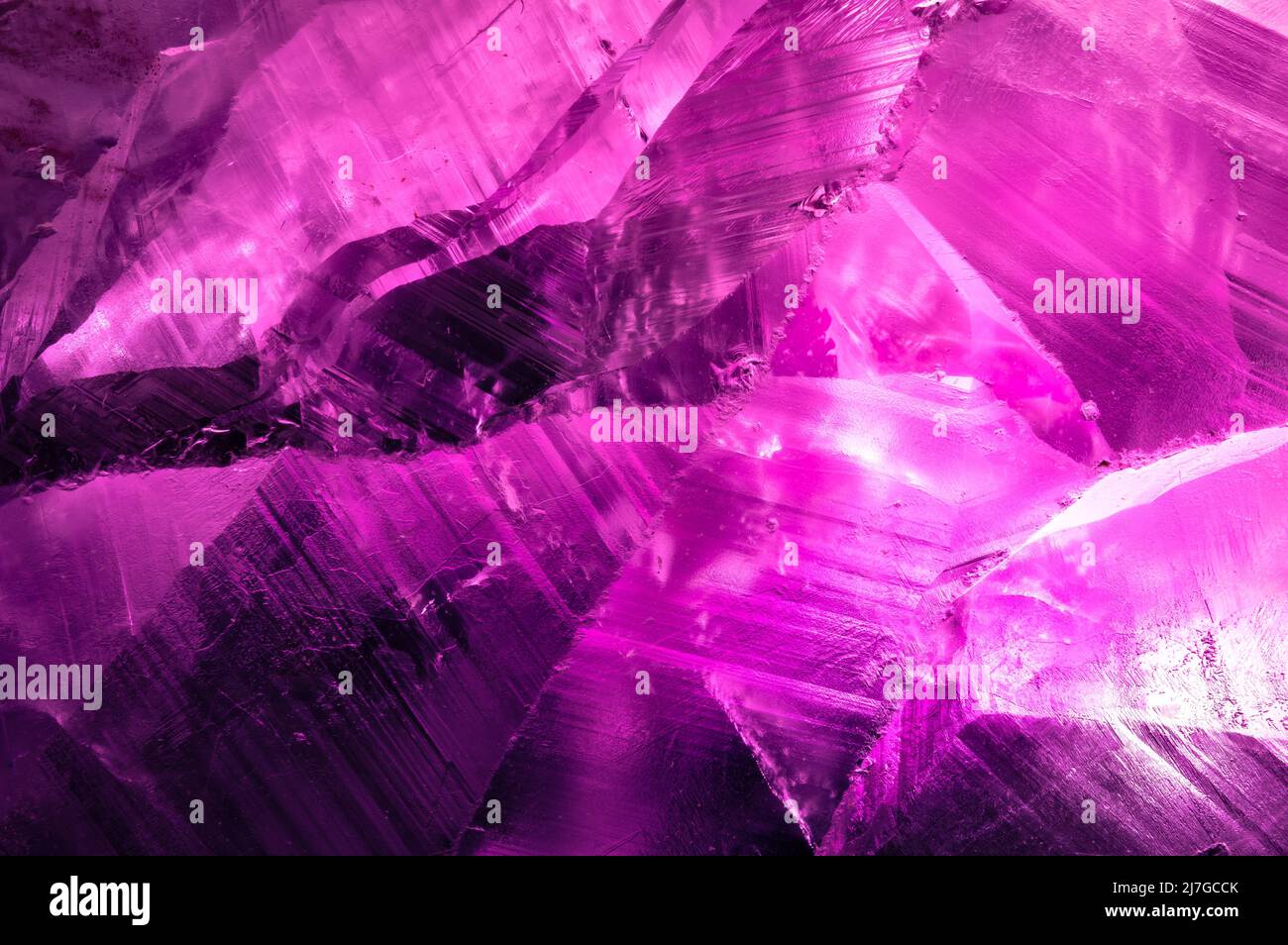 Amethyst rough crystal black background Stock Photo - Alamy