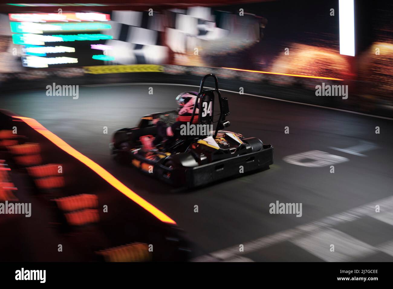 Electric Go kart driver speed rive indoor circuit race Stock Photo - Alamy