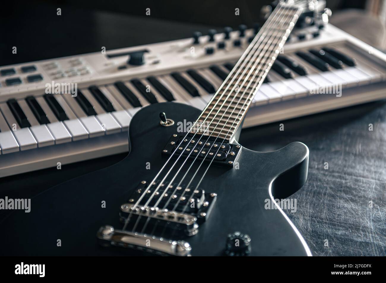 Close up, electric guitar and piano, musical creativity concept Stock ...