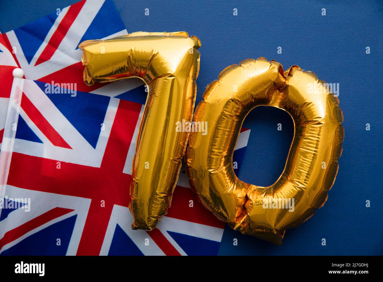 Number 70 balloons on a united kingdom union jack flag. Patinum jubilee ...