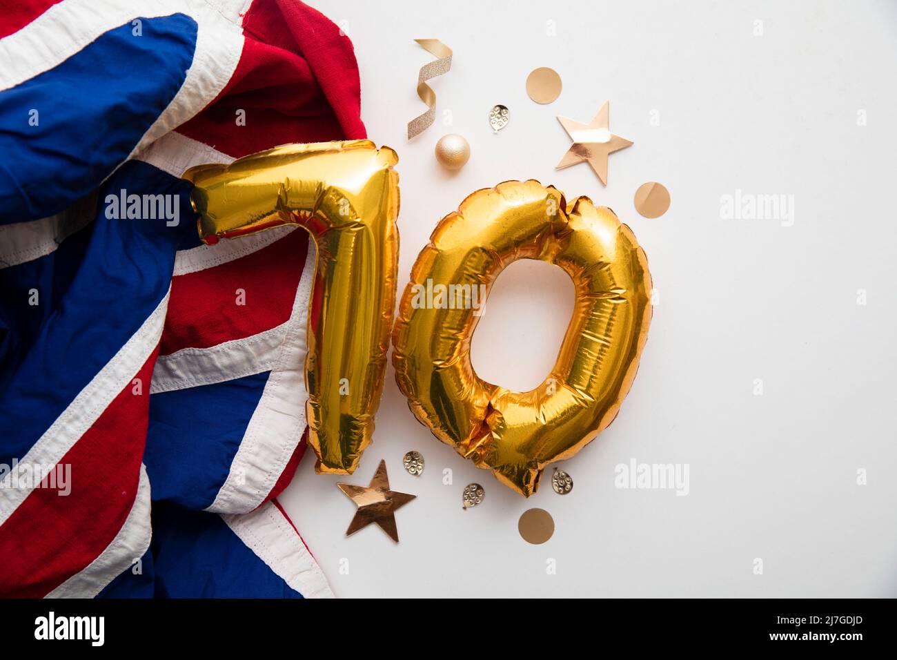 Number 70 balloons on a united kingdom union jack flag. Patinum jubilee ...