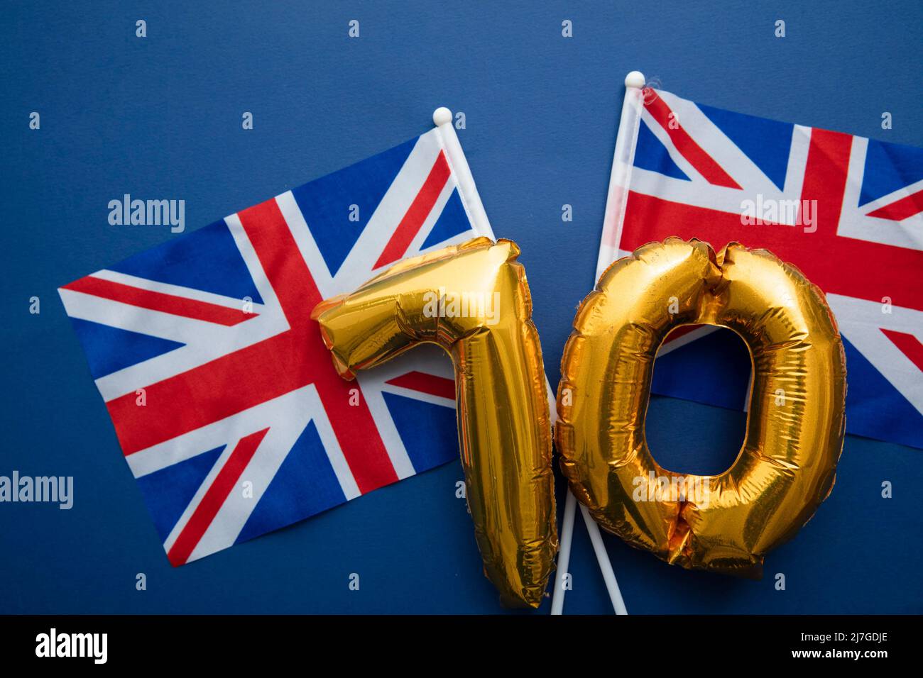 Number 70 balloons on a united kingdom union jack flag. Patinum jubilee ...