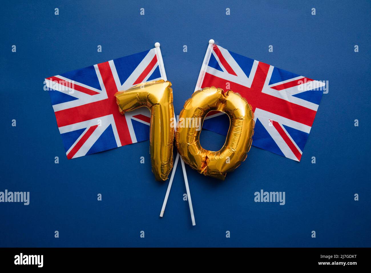 Number 70 balloons on a united kingdom union jack flag. Patinum jubilee ...
