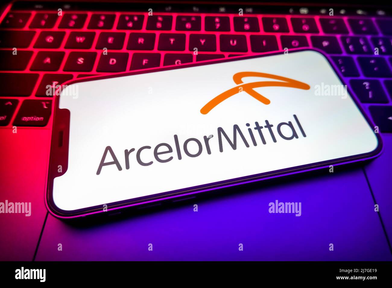 In this photo illustration, an ArcelorMittal logo seen displayed on a ...
