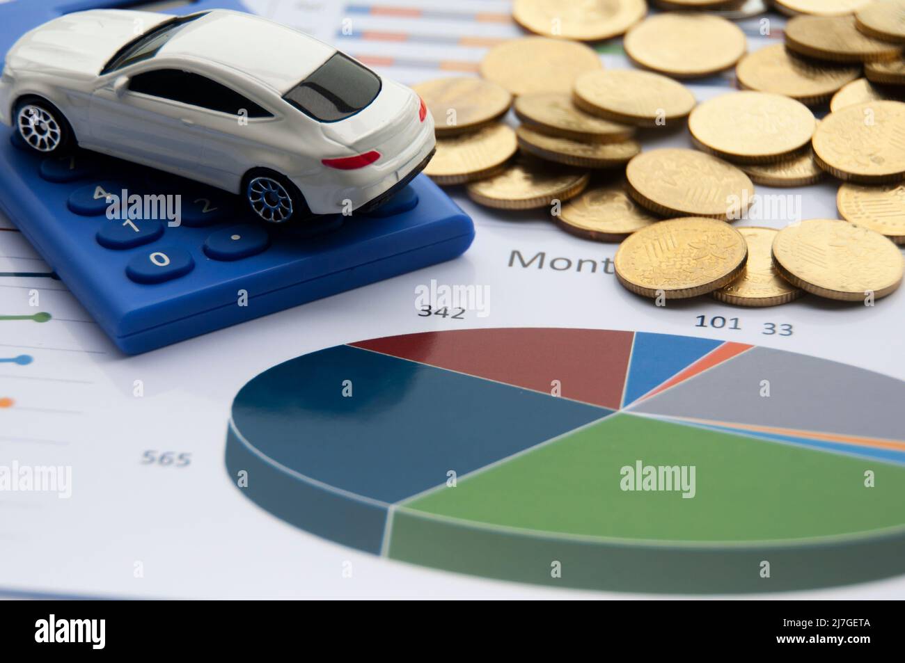 Pie chart with toy car, calculator and gold coins background. Business ...