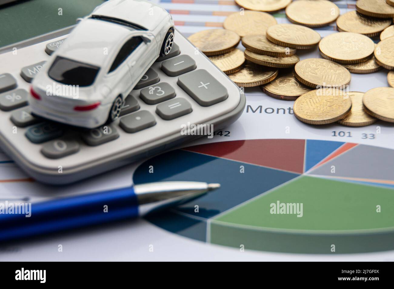Analysis of data, chart and graphs with isolated calculator, gold coins ...