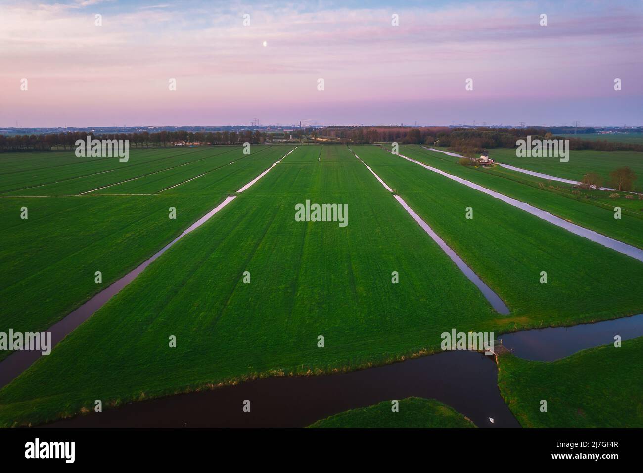 Aerial view of a village and farm agriculture fields in the countryside ...