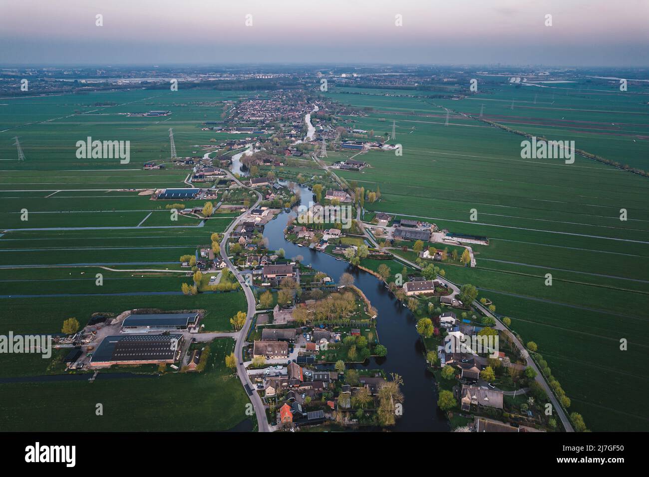 Aerial view of a village and farm agriculture fields in the countryside ...