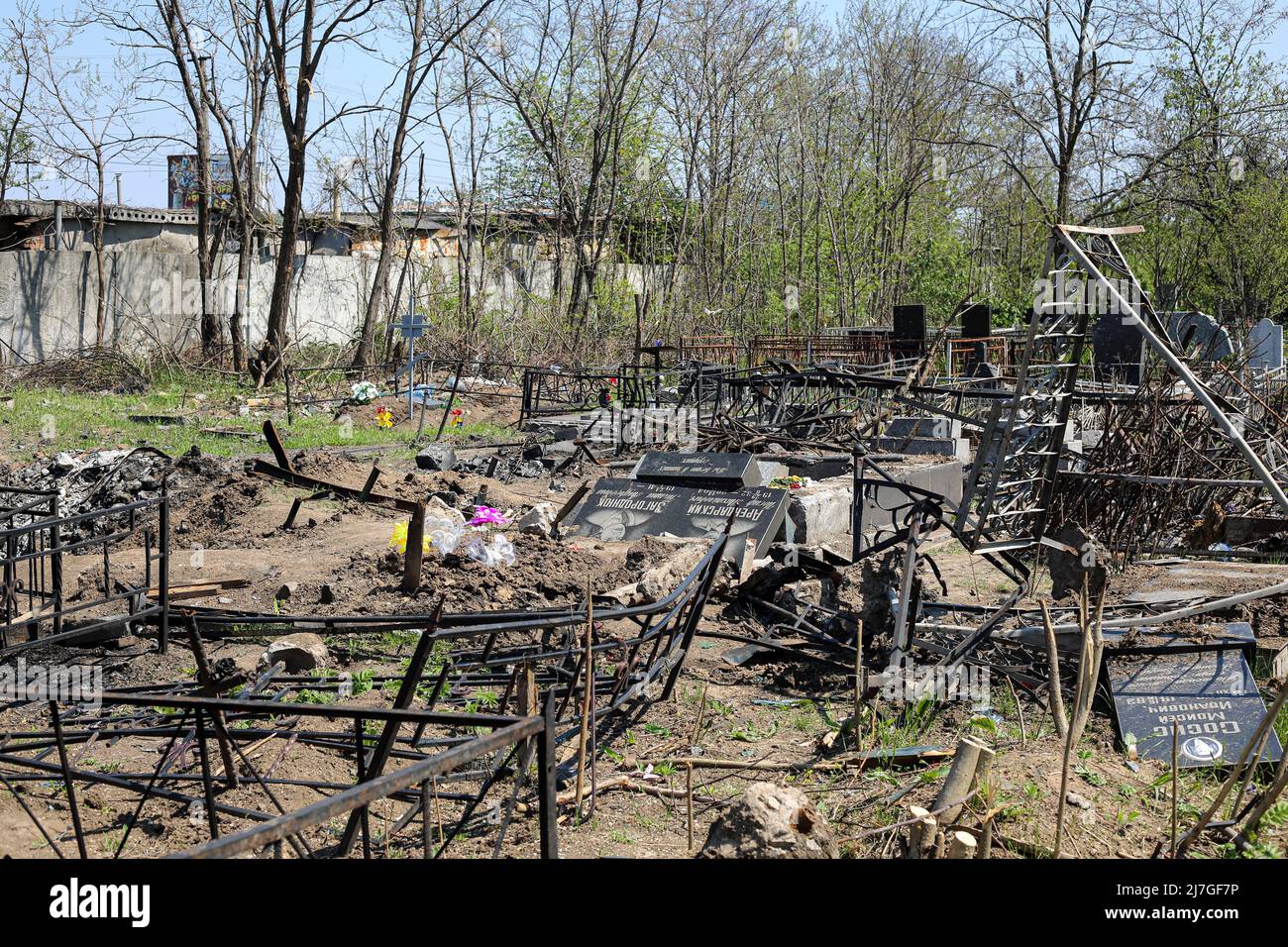 Destroyed monuments and burnt crosses in the cemetery during the Russia ...